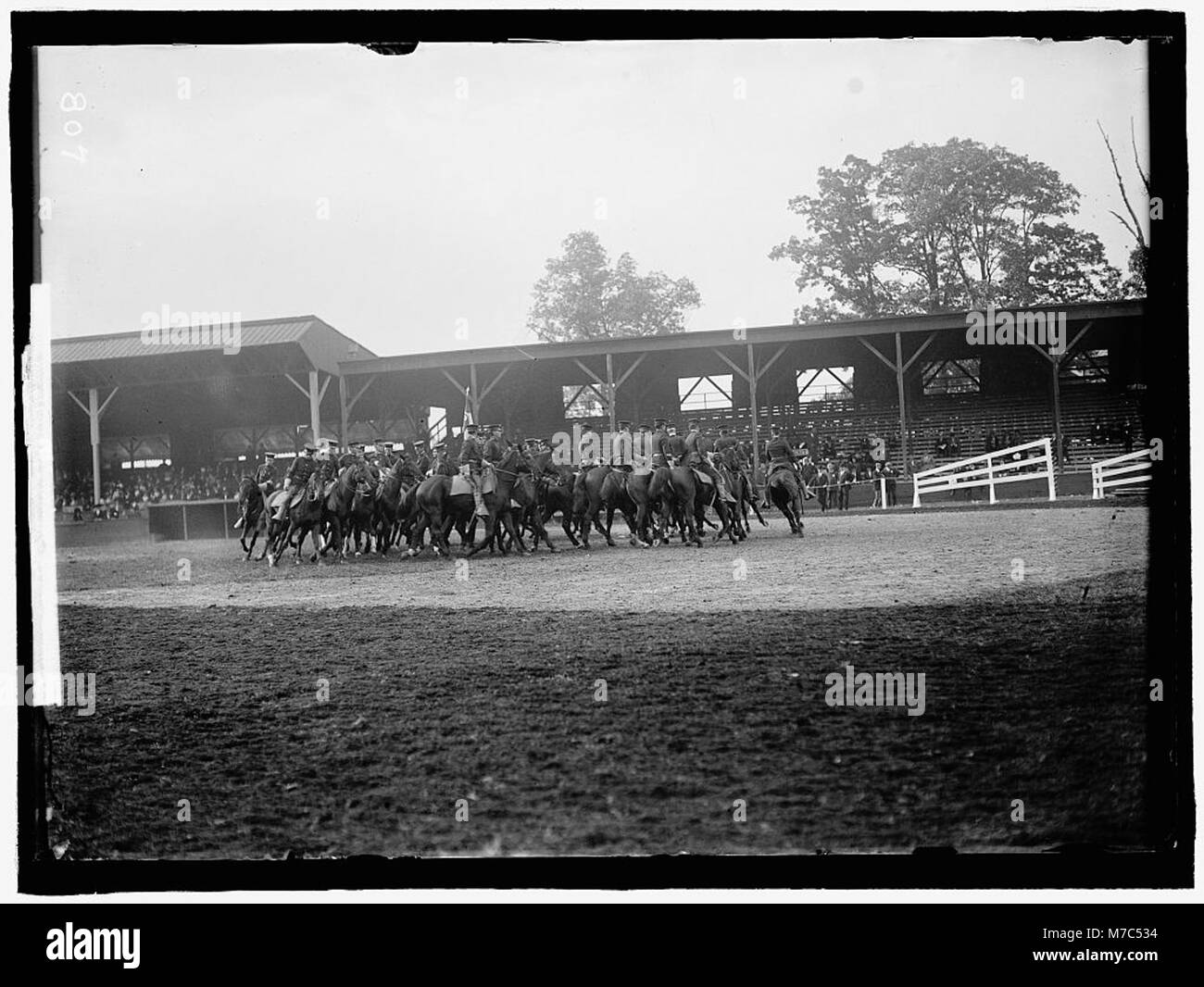 This photograph captures a horse show demonstration by the Fort Myer ...