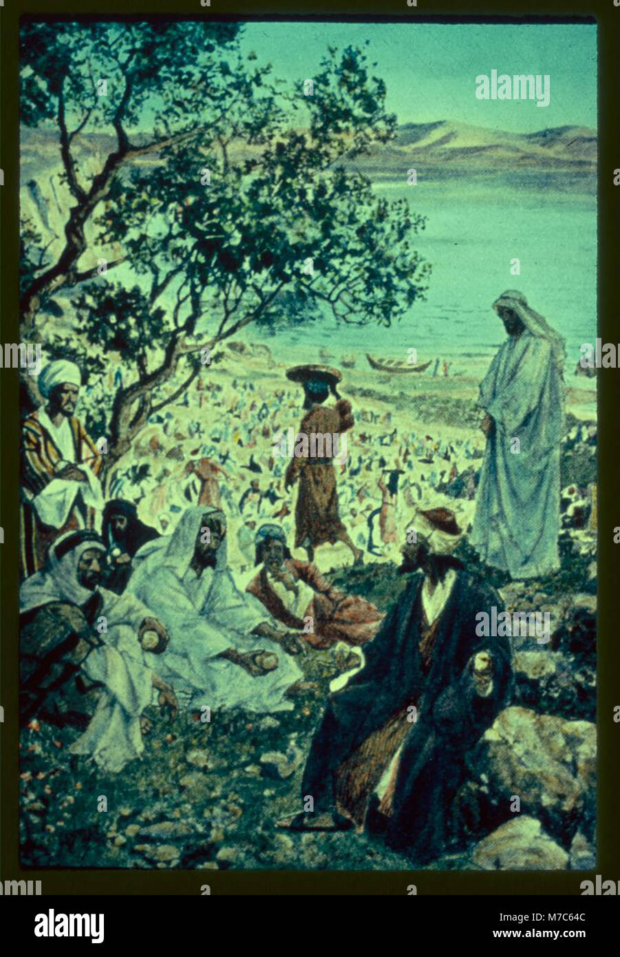 A depiction of Jesus, moved with compassion, miraculously feeding the ...