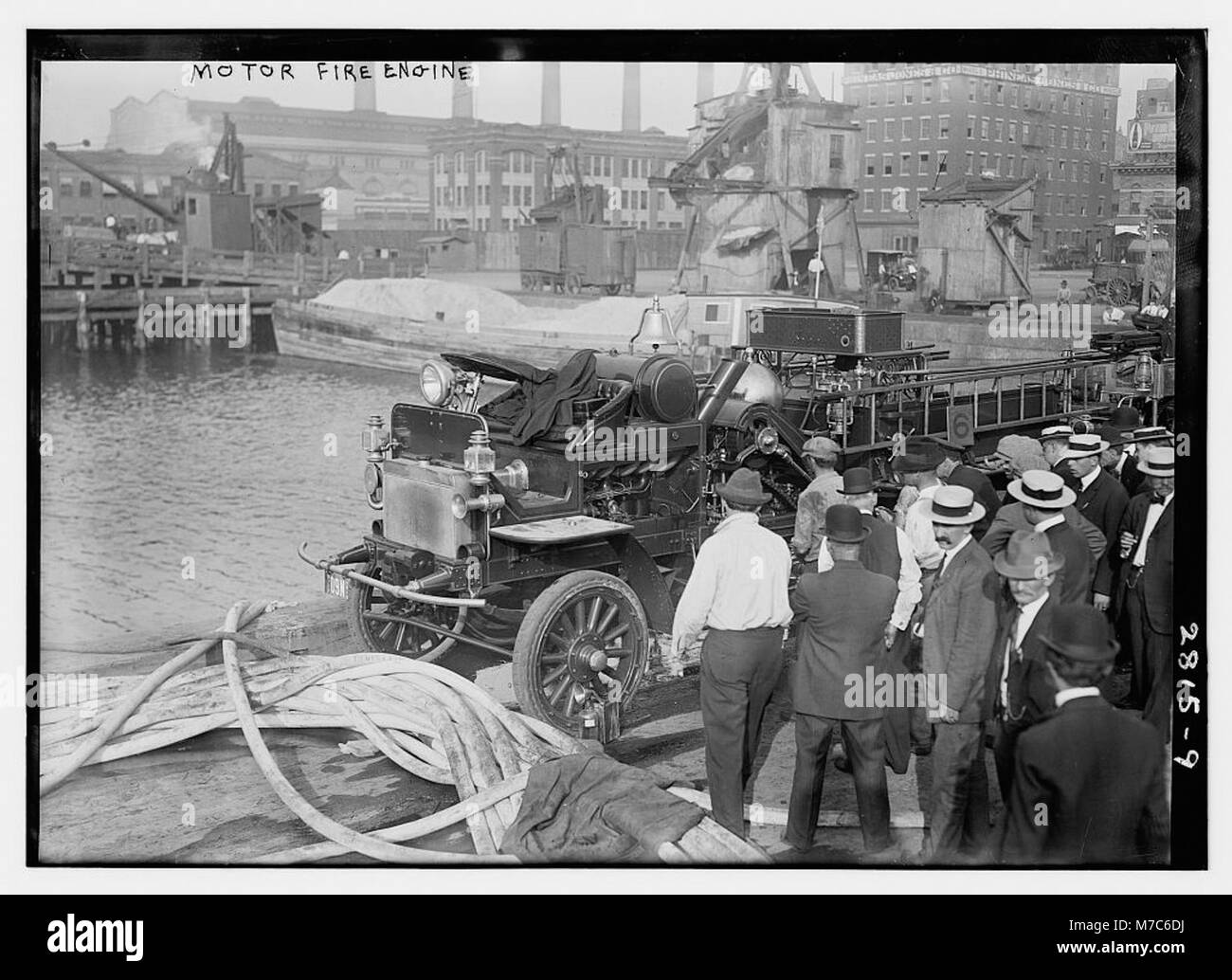 A vintage photograph of a motorized fire engine, highlighting the early ...