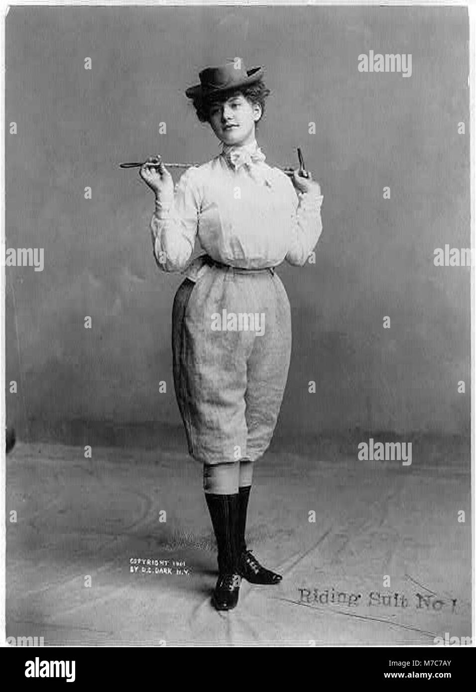 A fashion photograph showcasing a riding suit, identified as suit no. 1 ...
