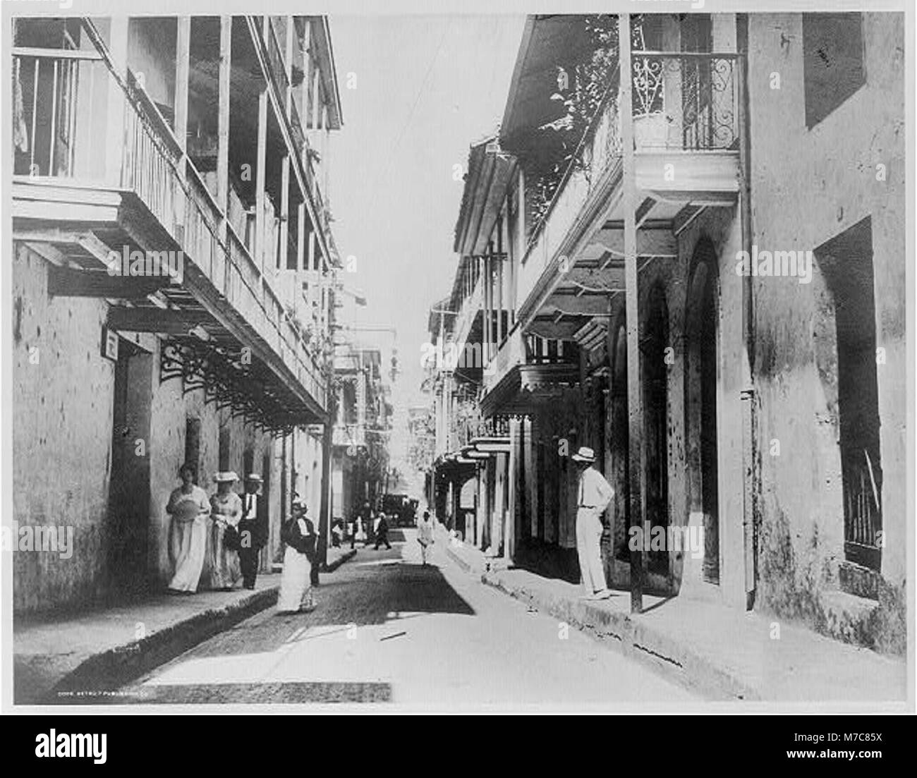 A typical street scene in Panama City is captured, depicting everyday ...