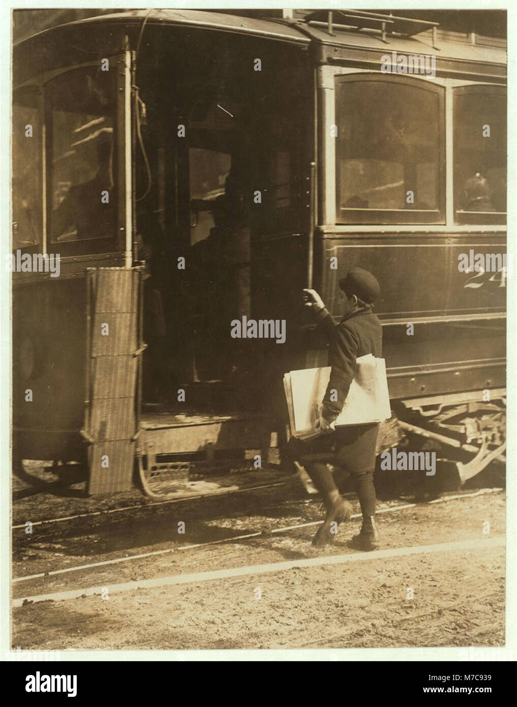 A photograph capturing Donato Dandrea, a newsboy, hopping cars at 10 A ...