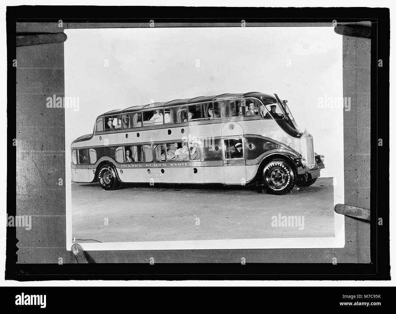 A double-decker bus from the Pickwick Stages System is shown ...