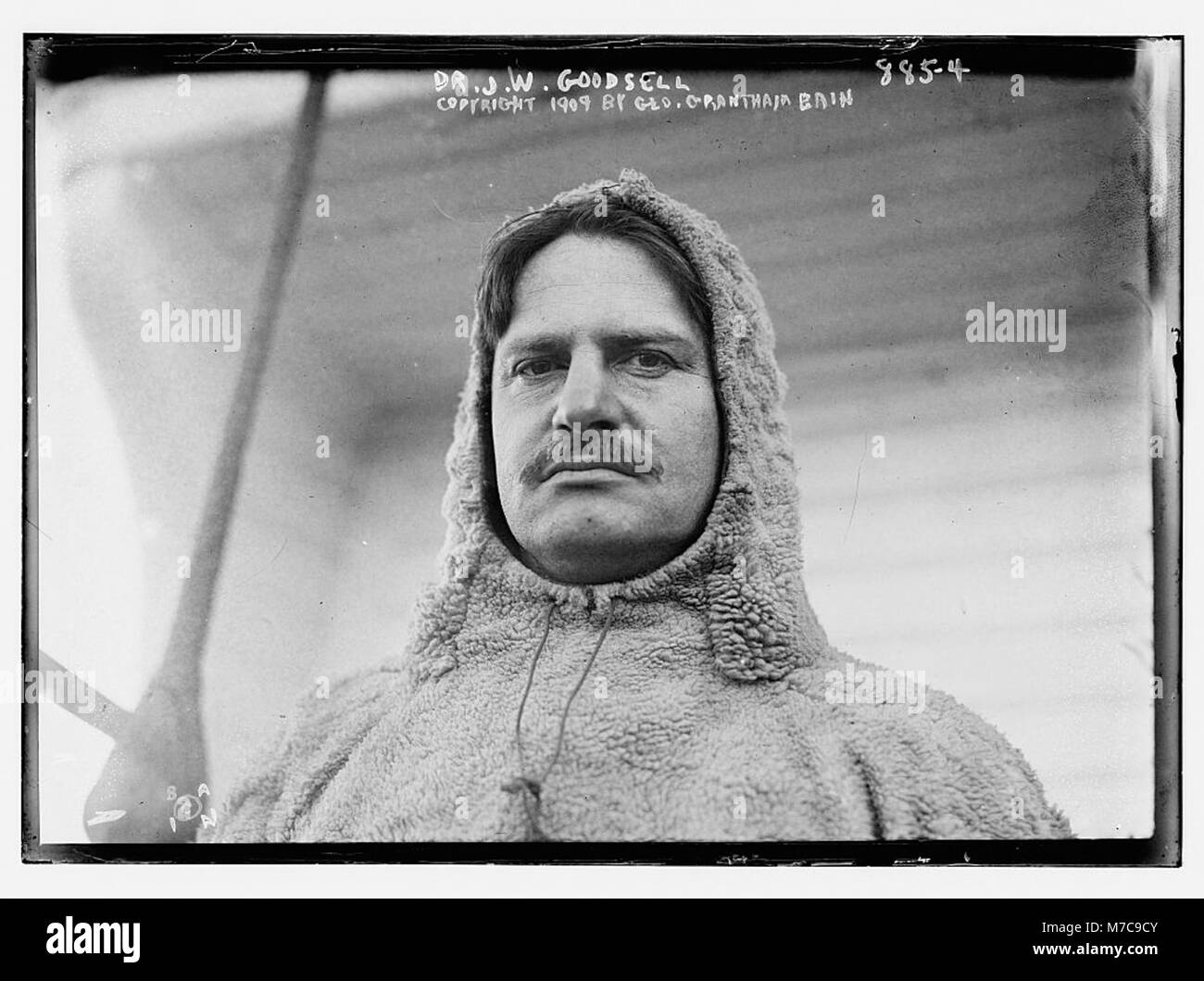A photograph of Dr. J.W. Goodsell, dressed in a fur parka. He is likely ...
