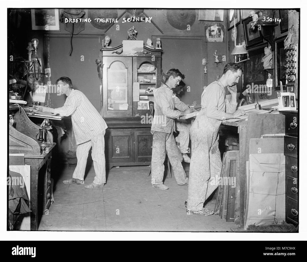 This photograph shows a scene depicting the process of drafting theatre ...