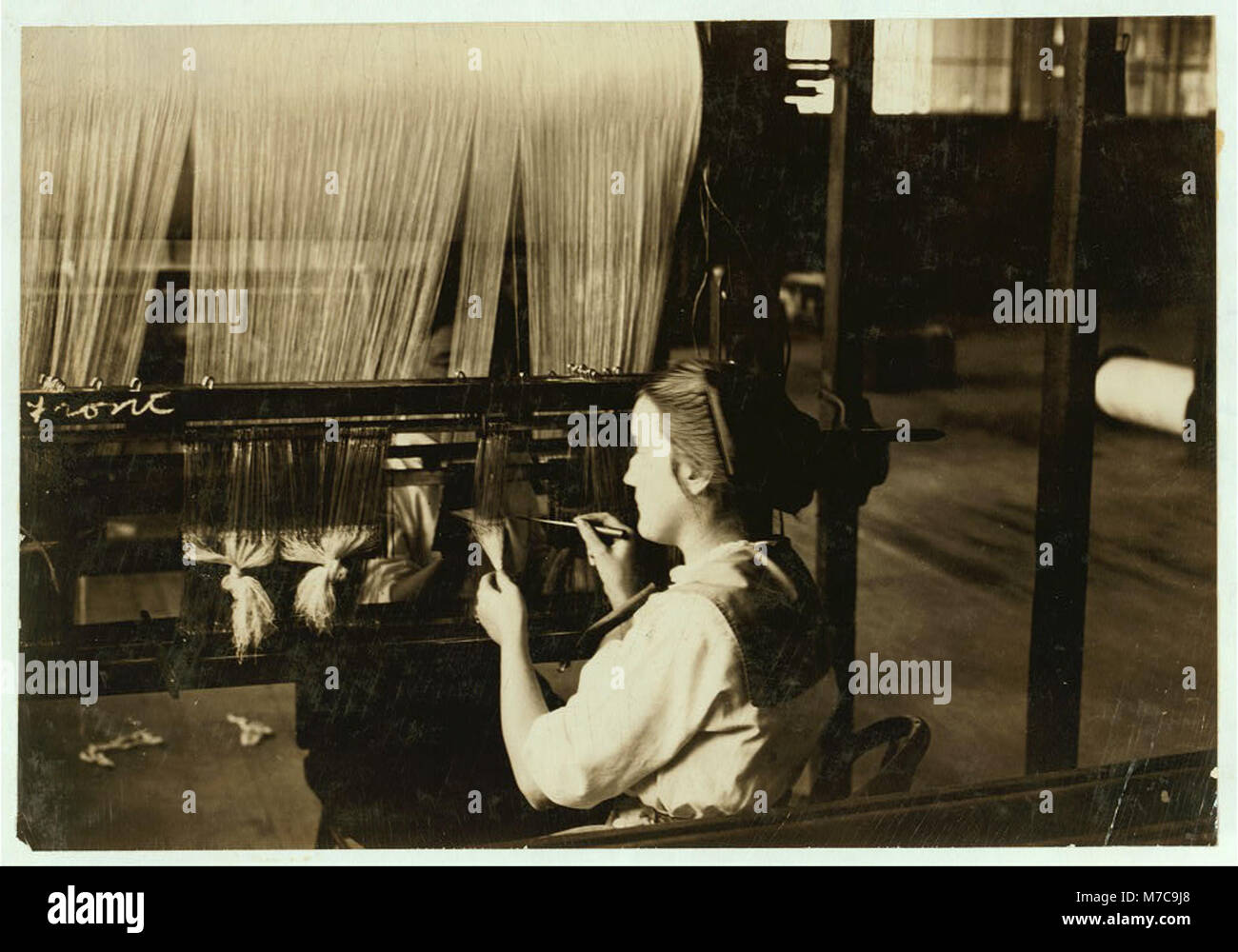 A photograph showing a drawer in a cotton mill, likely used for storing ...