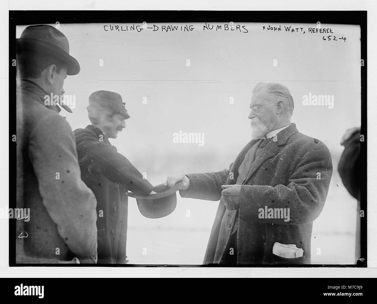 A photograph showing a curling game with John Watt acting as the ...