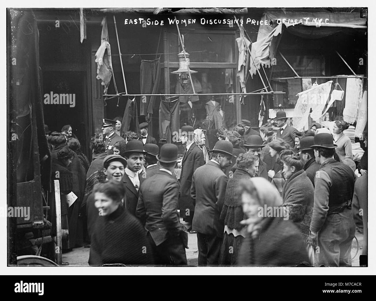 This image shows a crowd on the east side of New York City discussing ...