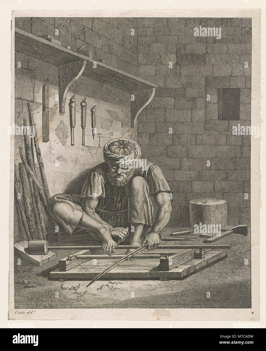 A photograph showing a traditional woodworker in his shop in the Near ...