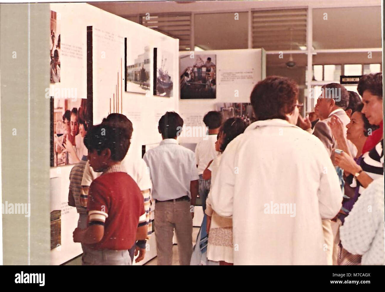 A photograph documenting an educational exhibition. The image reflects ...