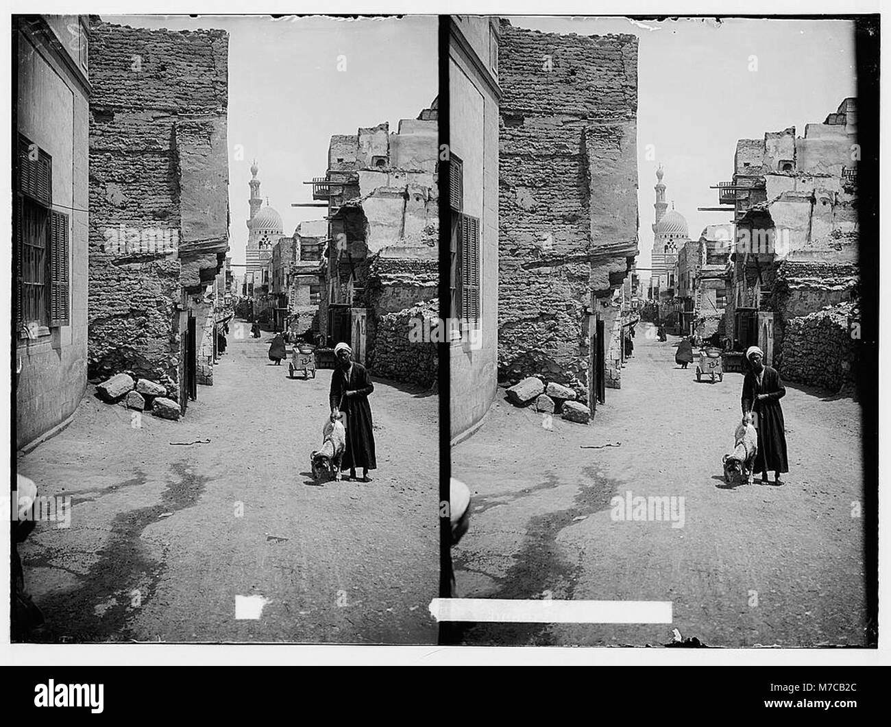 A photograph of a street in Cairo, Egypt, showcasing the bustling urban ...