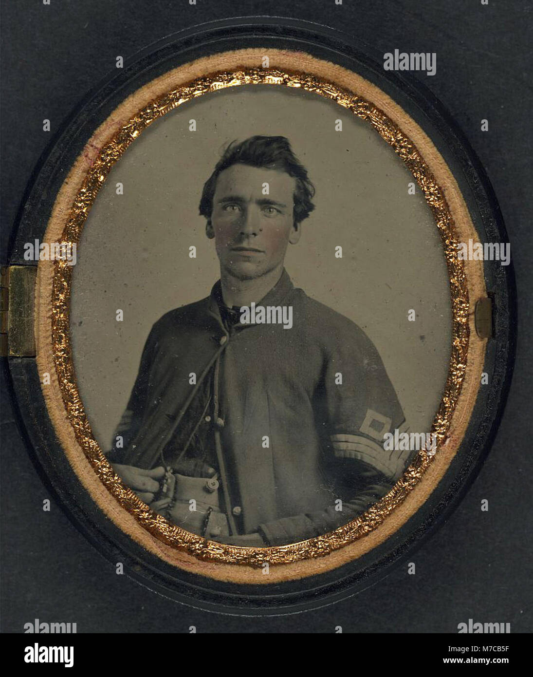 A photograph of an unidentified soldier wearing a Union first sergeant ...