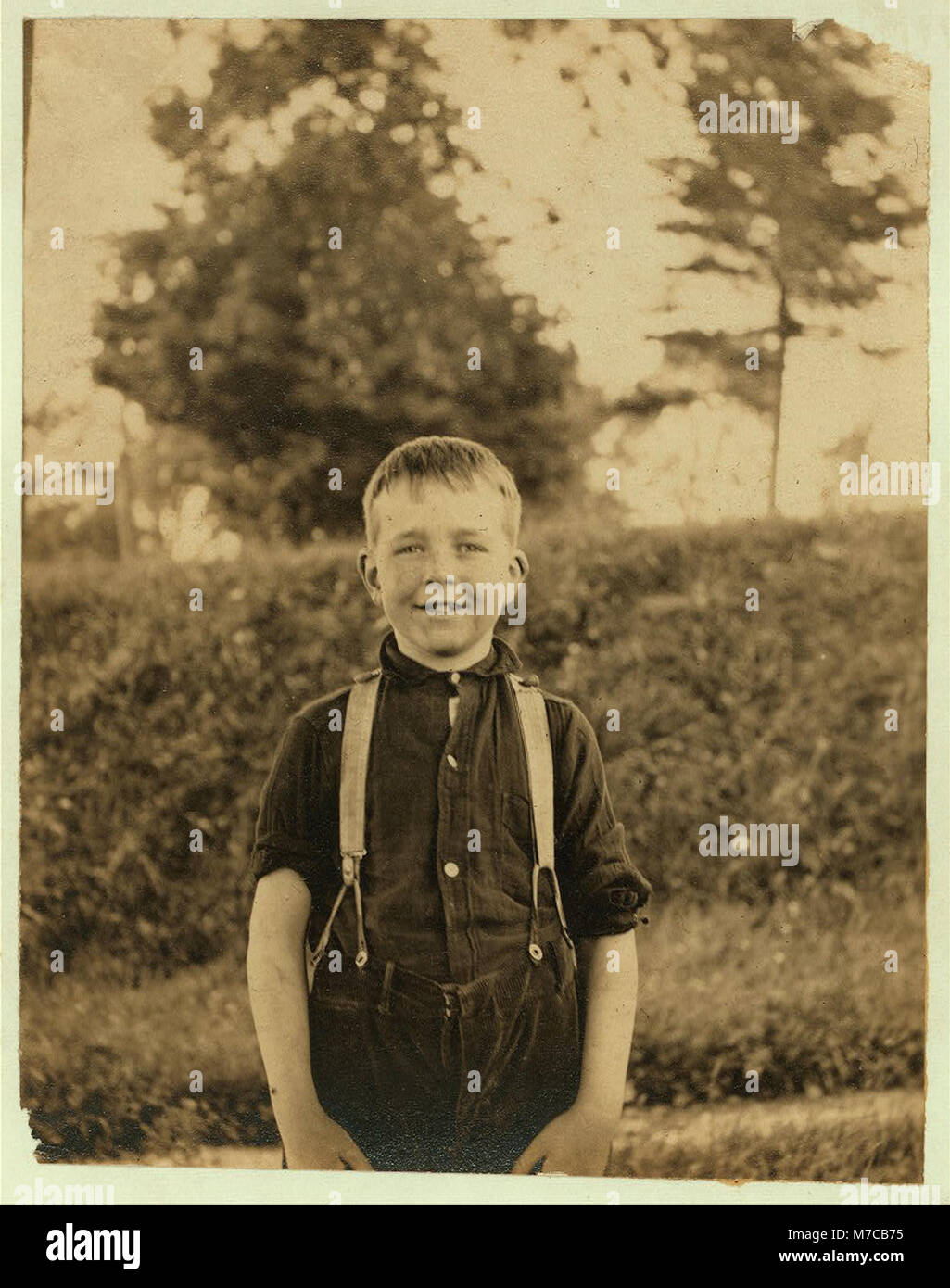 A photograph of an eight-year-old child named Jack working on a farm in ...