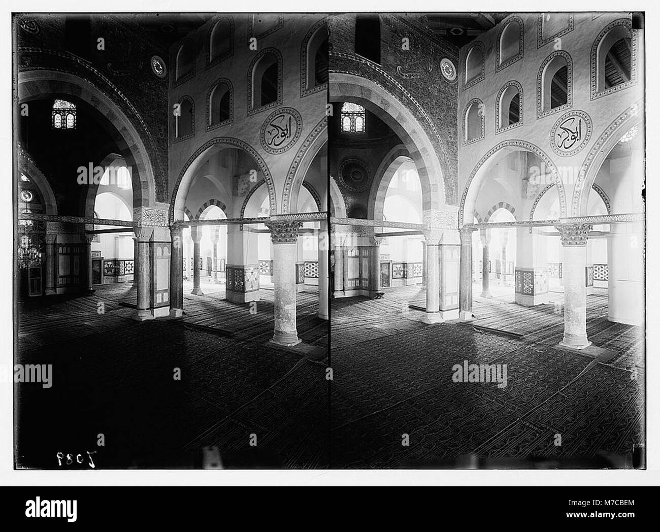 This interior photograph shows the southwest corner of the nave of the ...