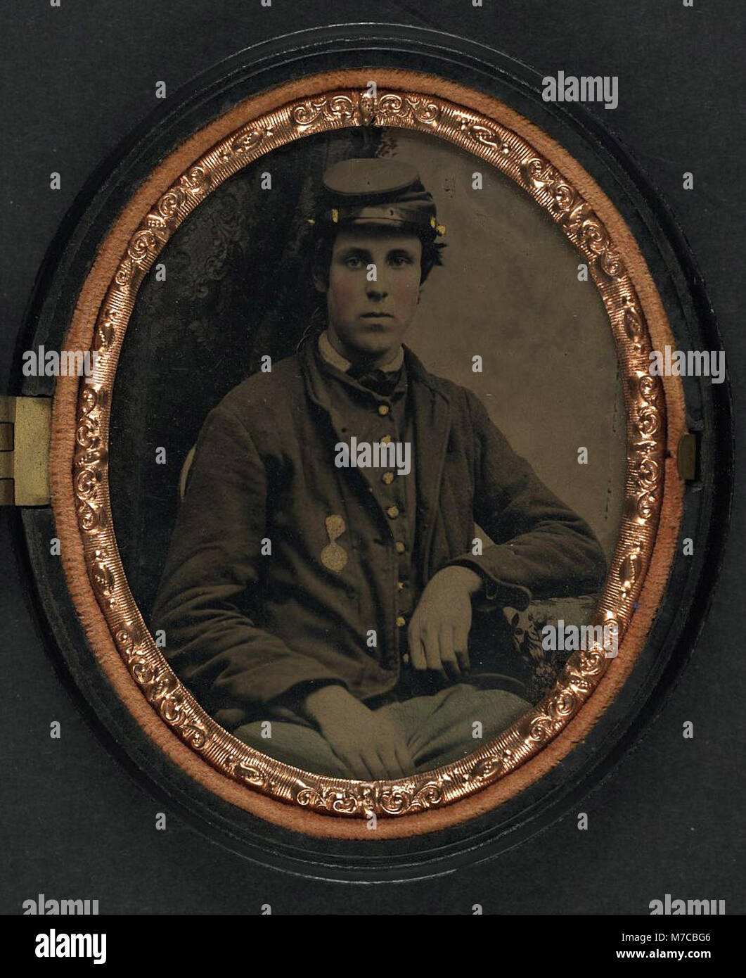 A photograph of an unidentified Union soldier wearing a military ...