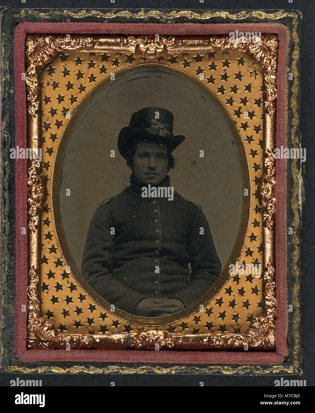 A young Union soldier, wearing an infantry shell jacket with shoulder ...