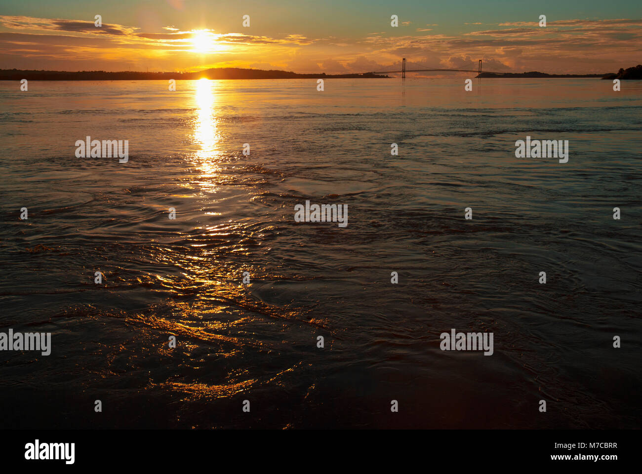 Reflection of sun in the river Stock Photo - Alamy