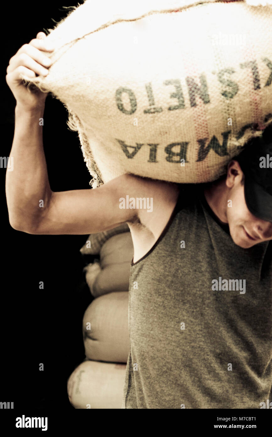 Worker carrying sack hi-res stock photography and images - Alamy