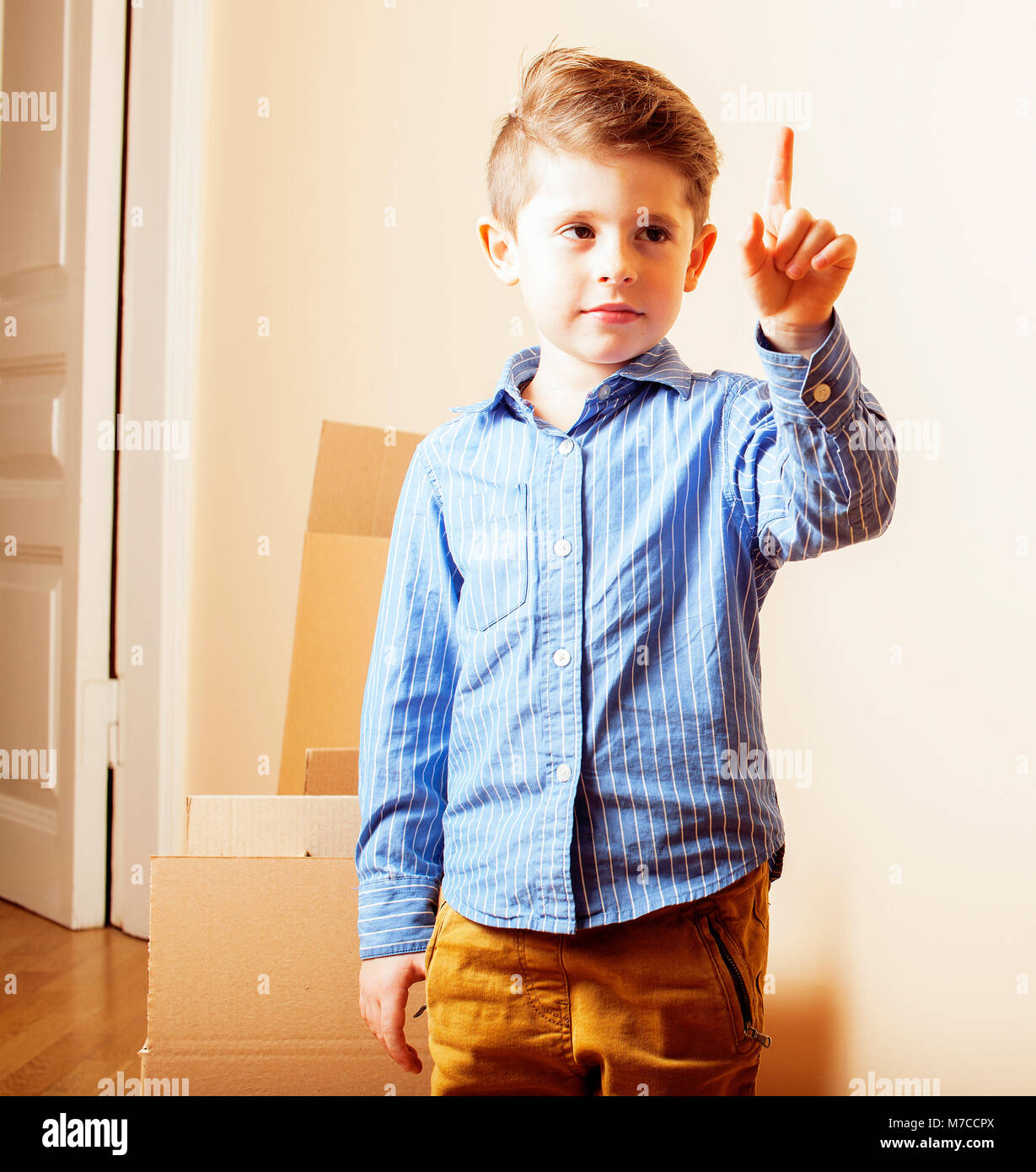 little cute boy in empty room, remoove to new house. home alone Stock ...