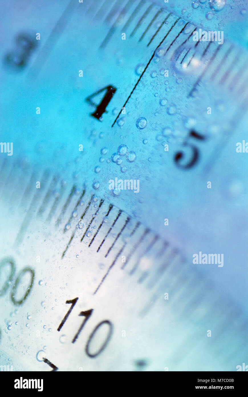 Close-up of a protractor and a ruler in water Stock Photo - Alamy