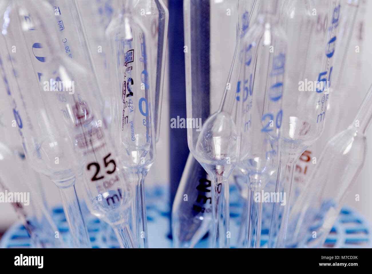 Close-up of pipettes on a rack Stock Photo - Alamy