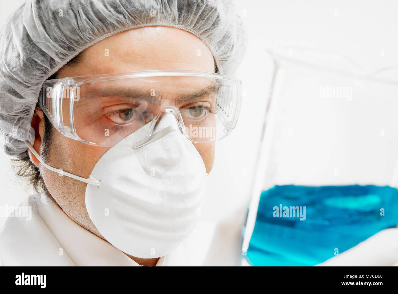 Close up of a person holding a beaker hi-res stock photography and ...