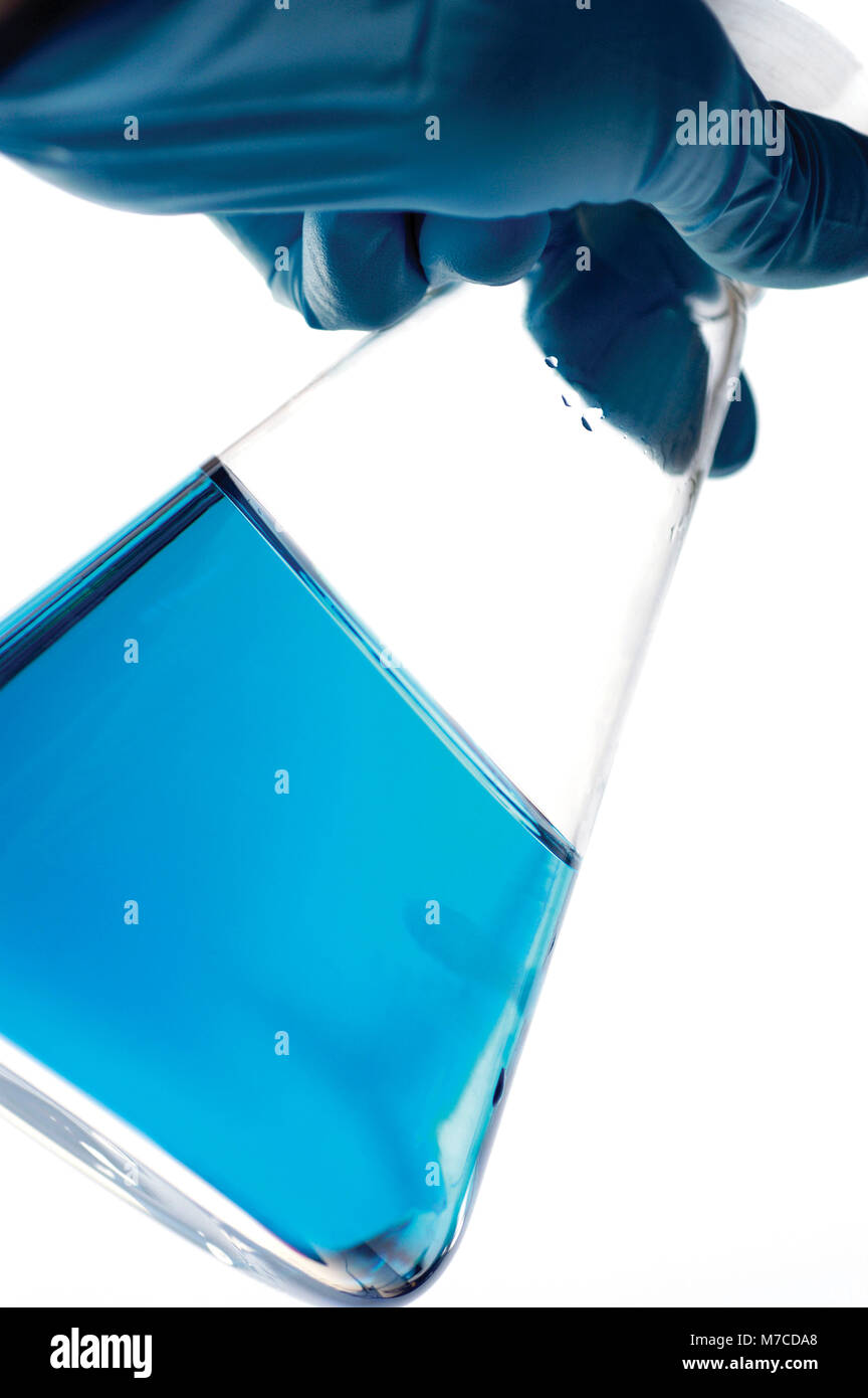 Close-up of a flask in a person's hand Stock Photo - Alamy