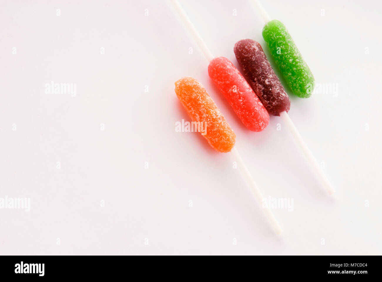 High angle view of four lollipops Stock Photo - Alamy