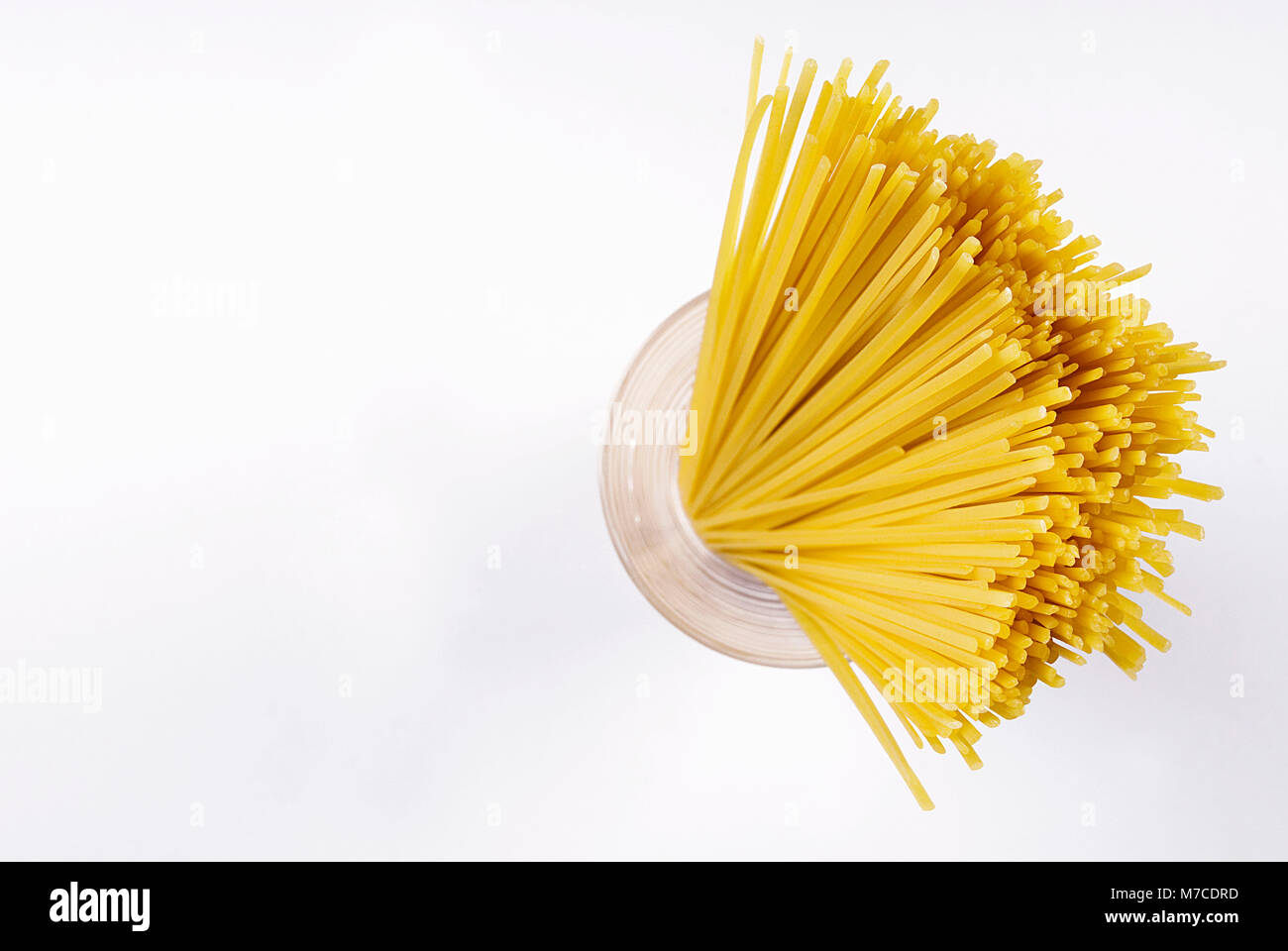 High angle view of raw spaghetti in a glass Stock Photo - Alamy