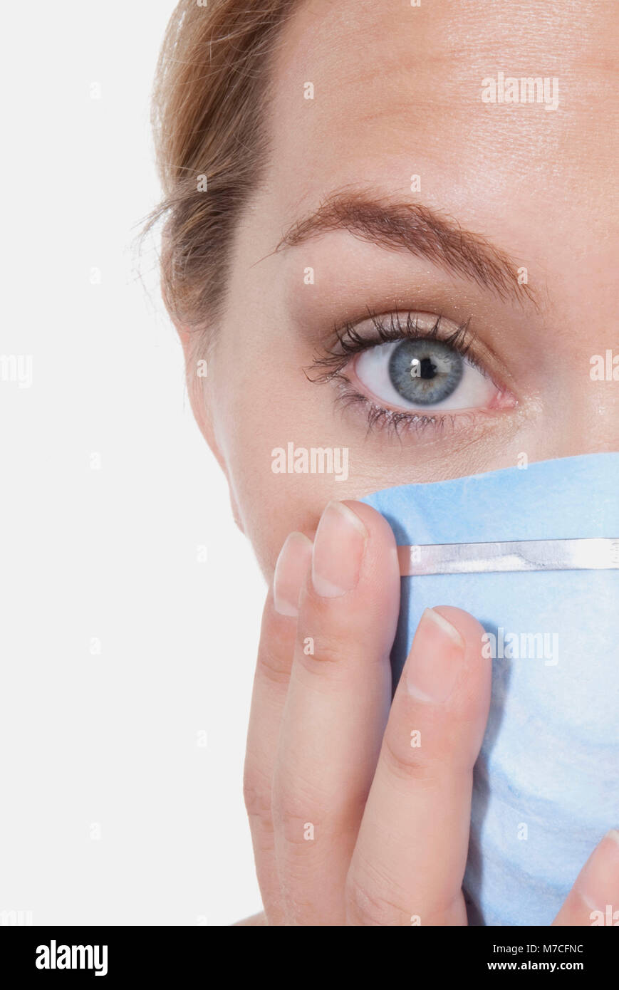 Female doctor wearing a flu mask Stock Photo - Alamy