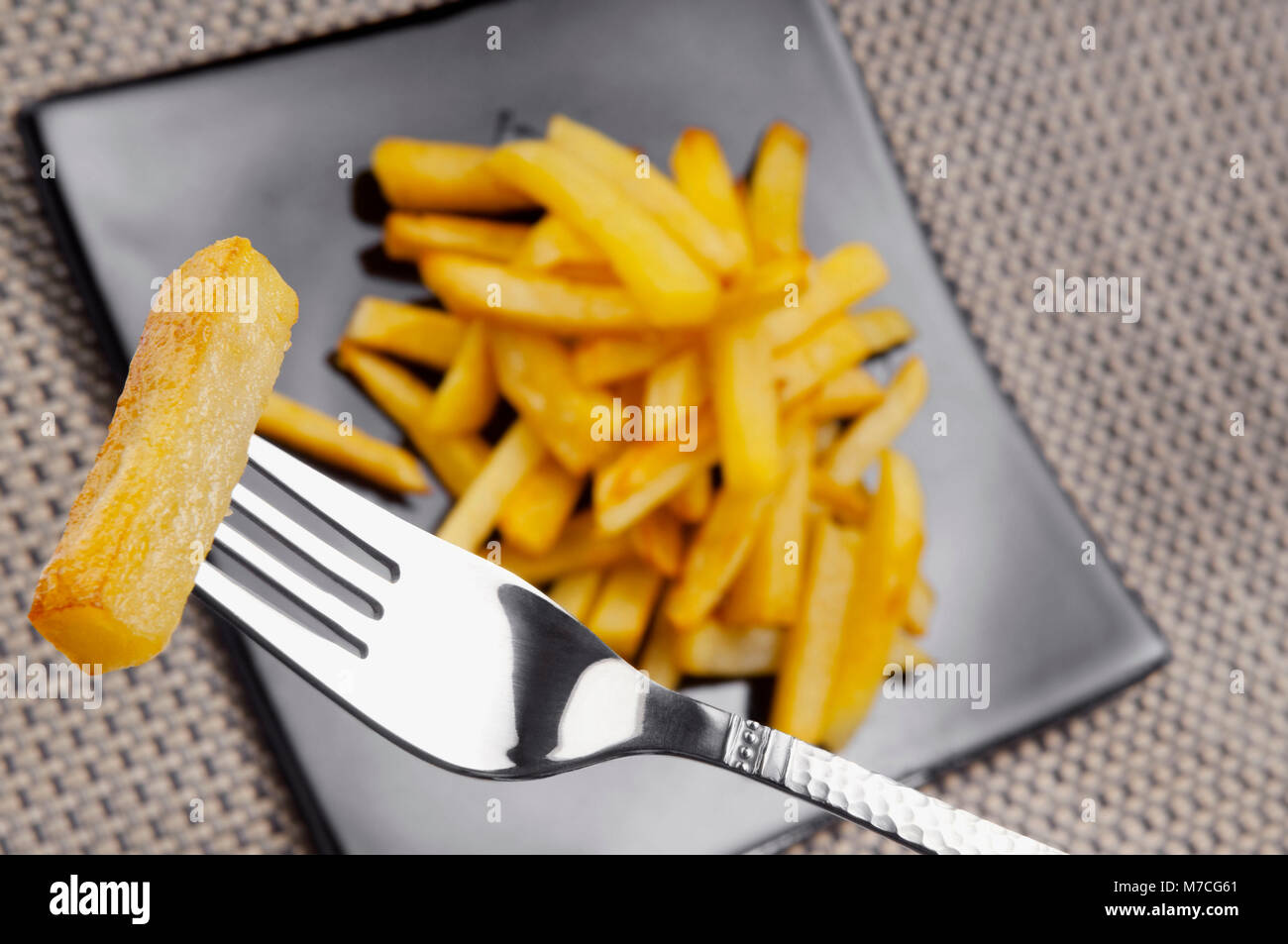 Close-up of a french fry on a fork Stock Photo - Alamy