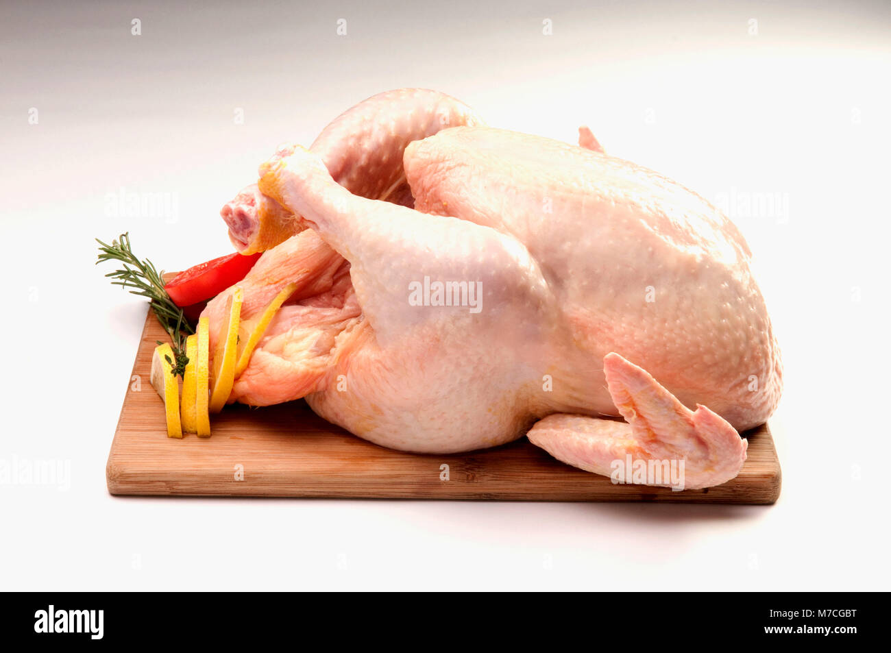 Close-up of an uncooked turkey on a chopping board Stock Photo - Alamy