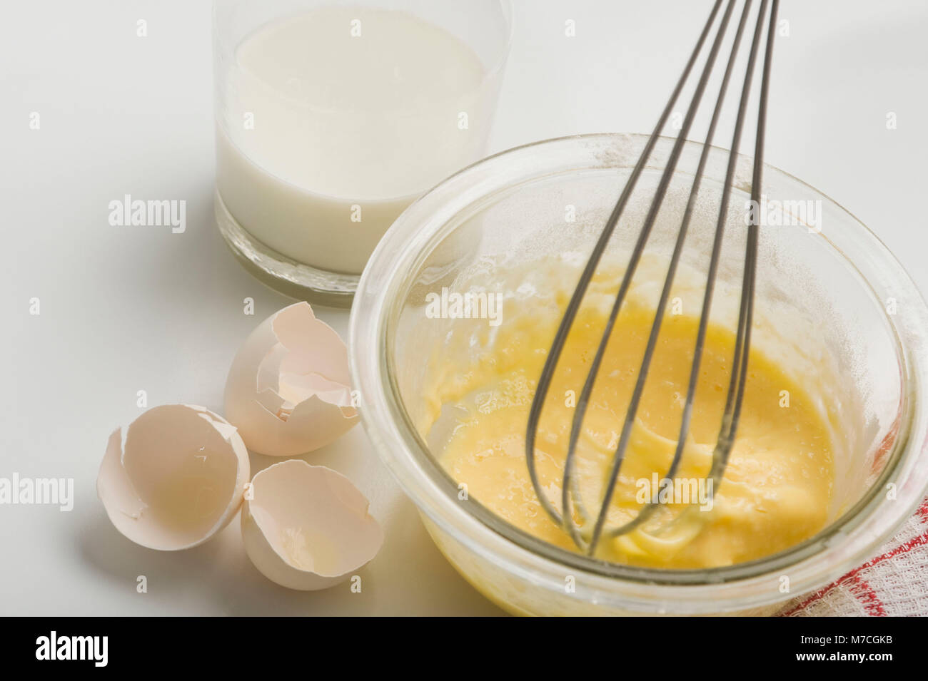 Metal whisk stirring egg mixture in a bowl hi-res stock photography and ...