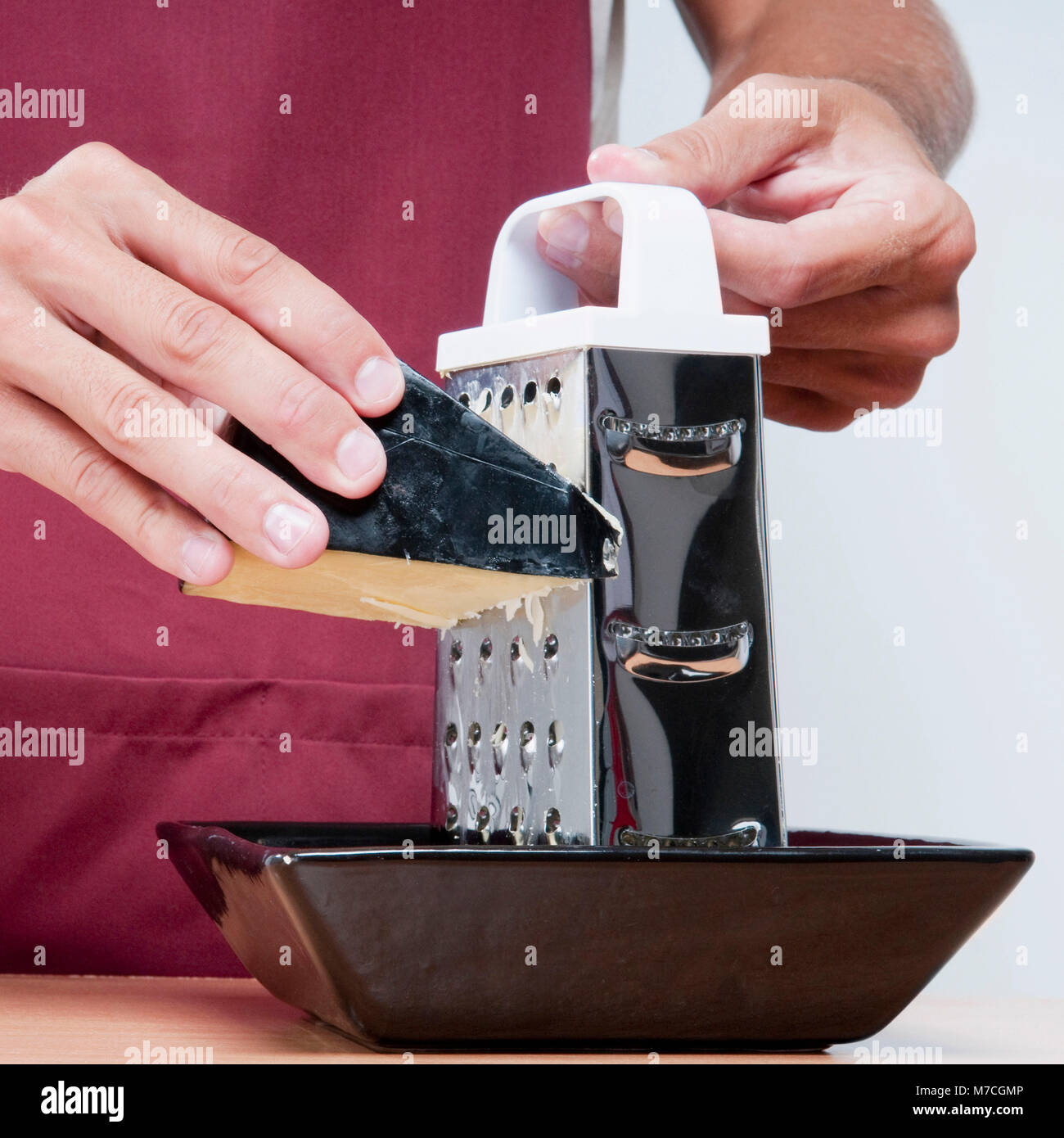 Grating cheese on grater close hi-res stock photography and images - Alamy