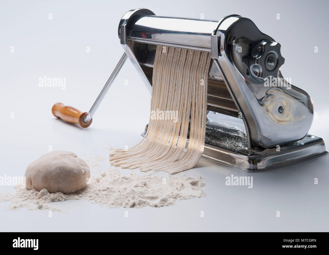 Pasta being cut with a pasta maker Stock Photo - Alamy