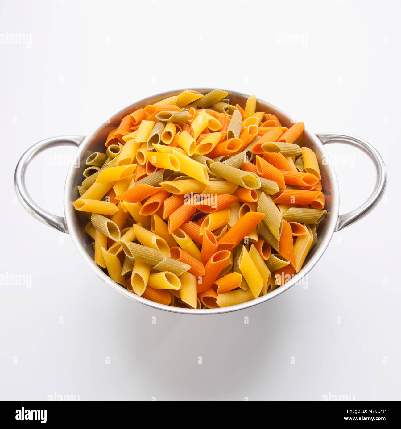 Multi colored rigatoni pasta in a strainer Stock Photo - Alamy