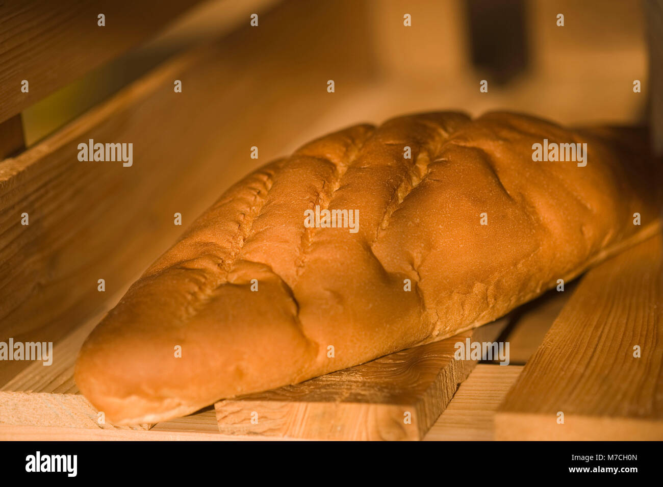 Close-up of a loaf of bread in a crate Stock Photo - Alamy