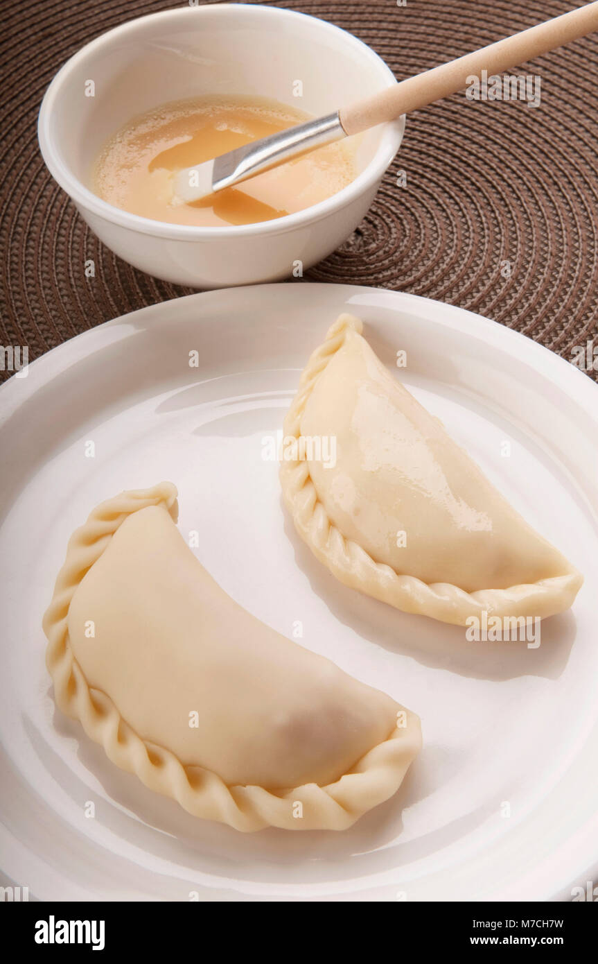 Close up of pastry brush and homemade panzarotti hi-res stock ...