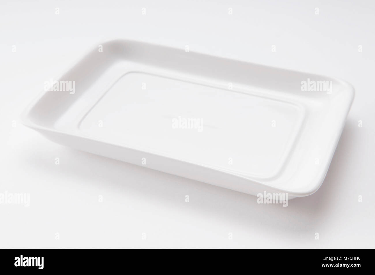 Close-up of an empty white tray Stock Photo - Alamy