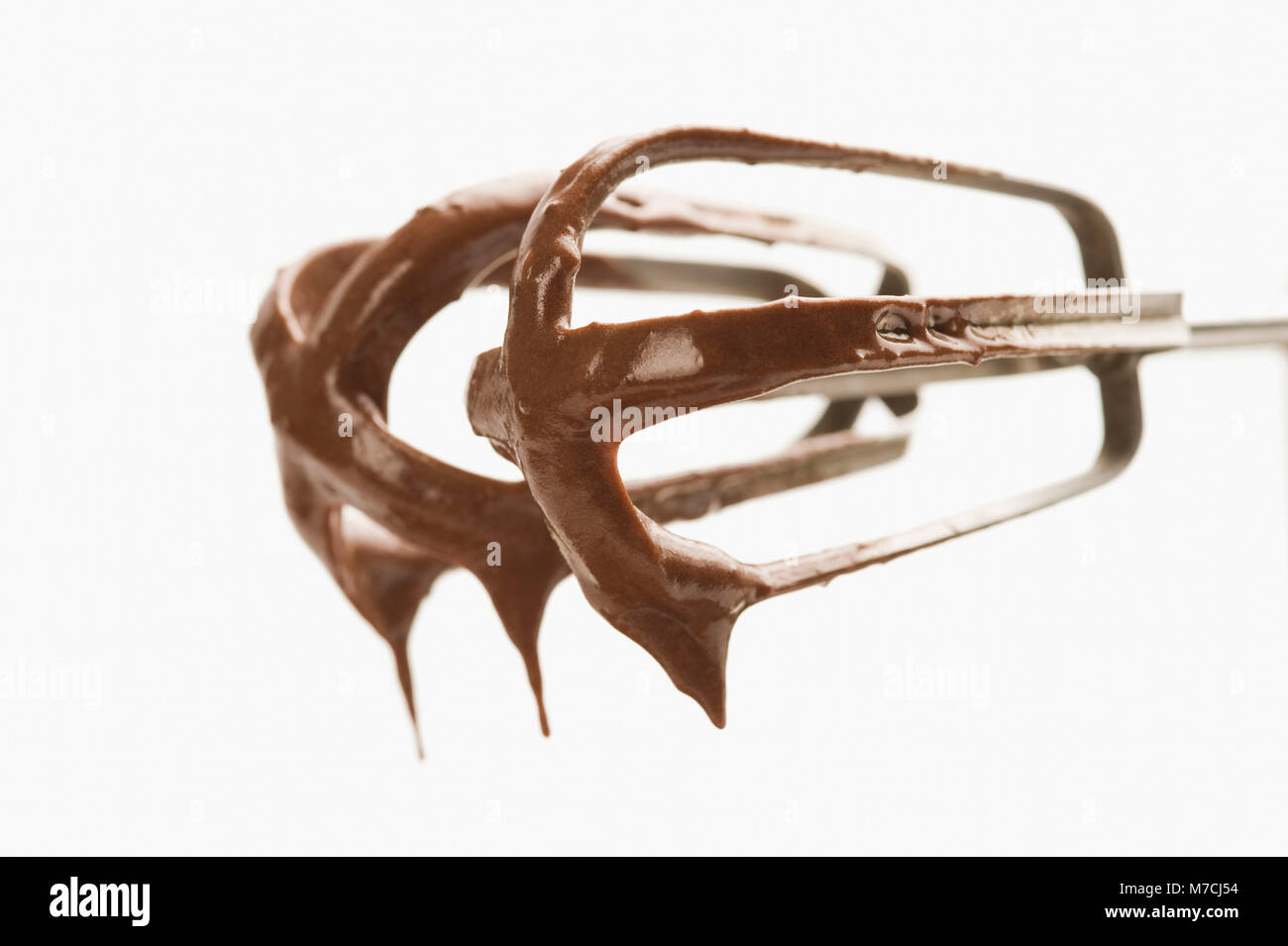 Chocolate fondue on a mixer beater Stock Photo - Alamy