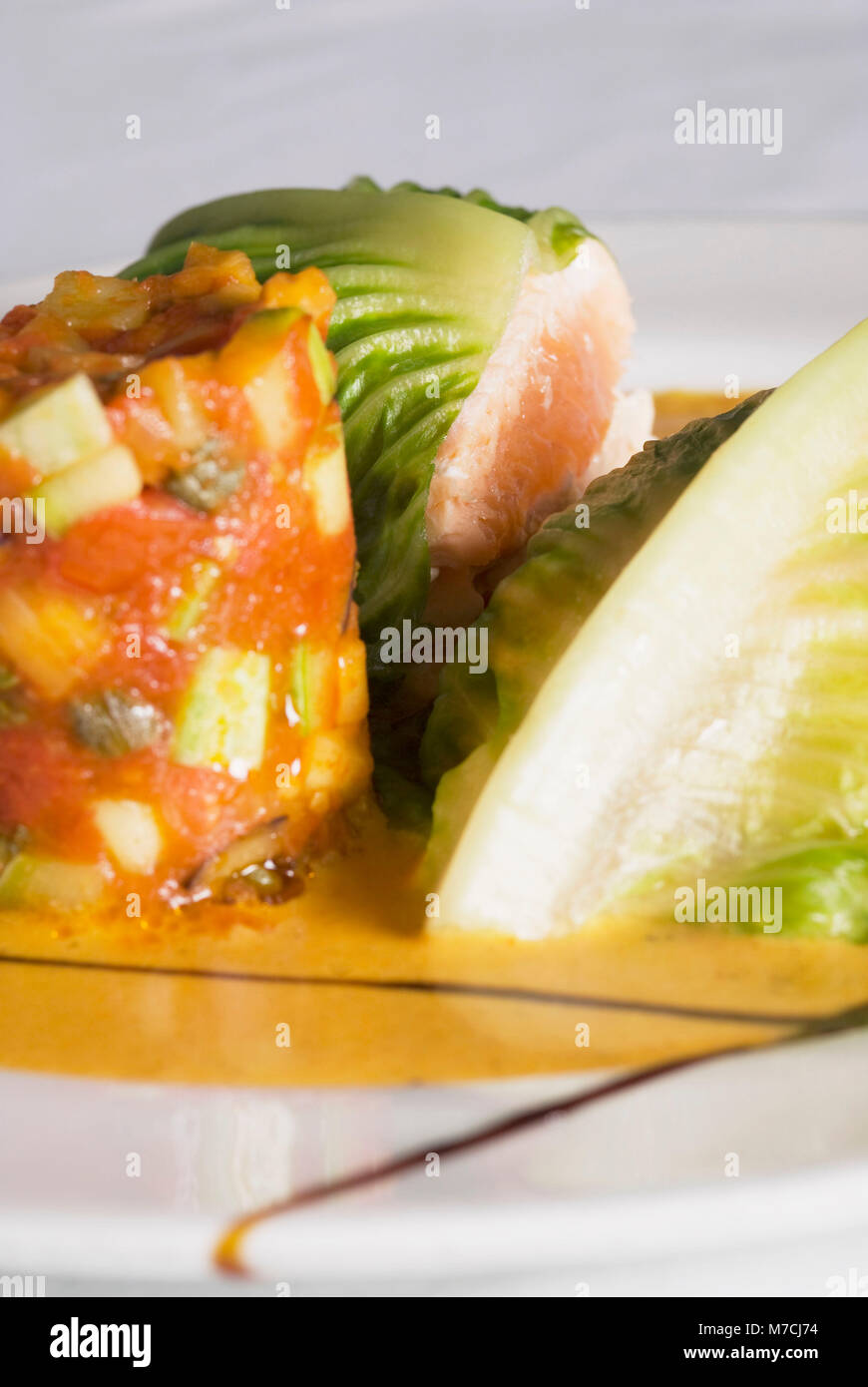 Close-up of fish steaks wrapped in cabbage leaves Stock Photo - Alamy