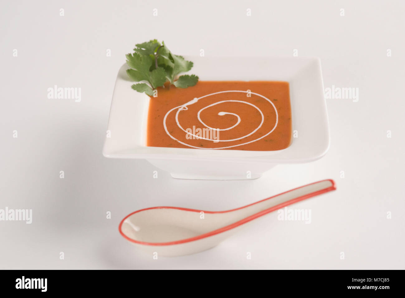 Close-up of a bowl of tomato soup garnish with cream Stock Photo - Alamy