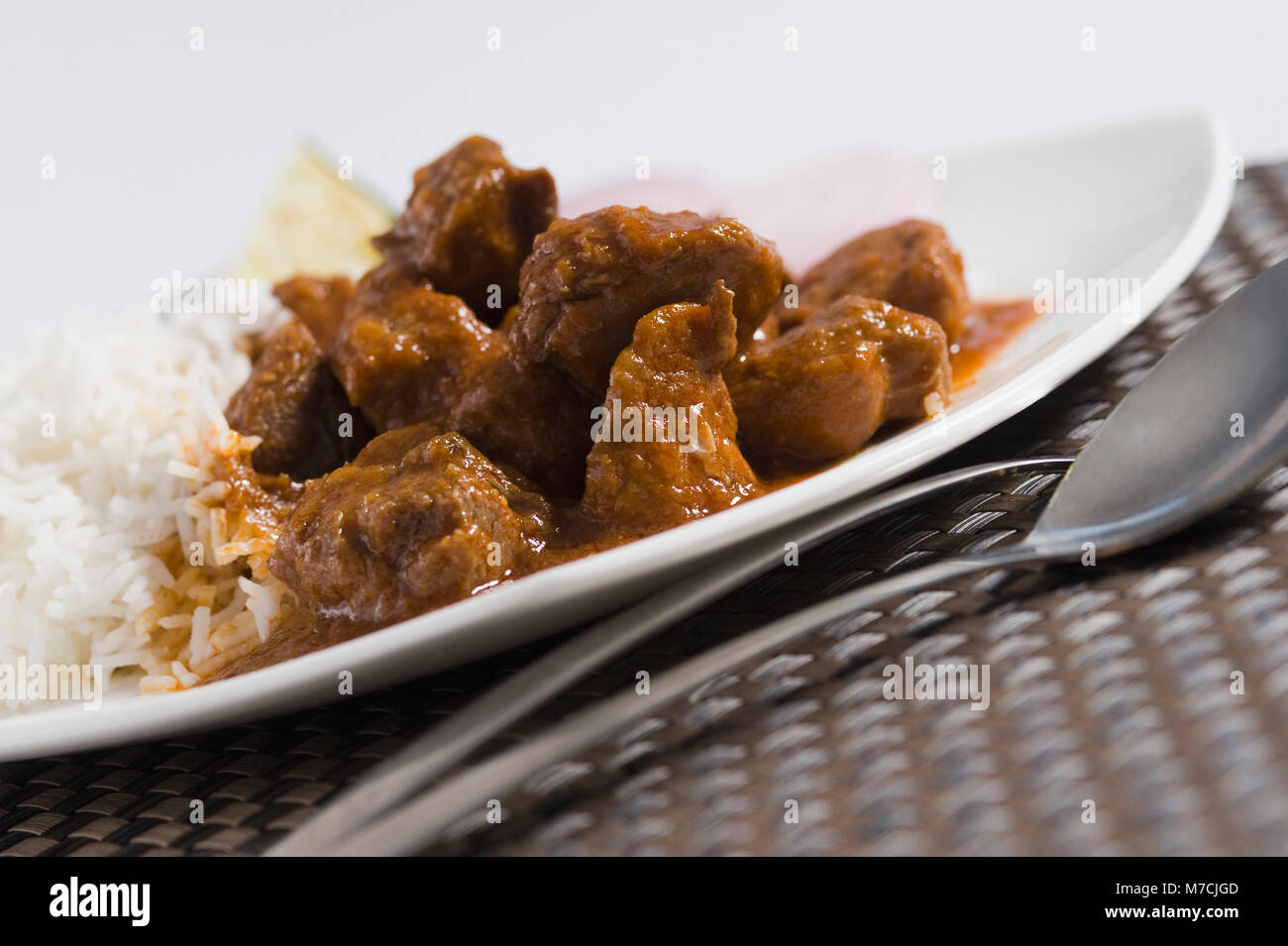 Close-up of mutton curry served with rice Stock Photo - Alamy