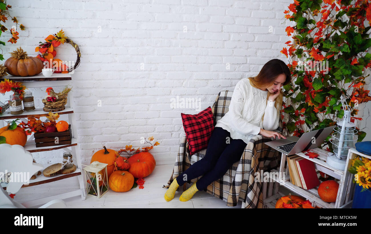 Female Student Corresponds With Friends on Internet, Using Laptop and ...