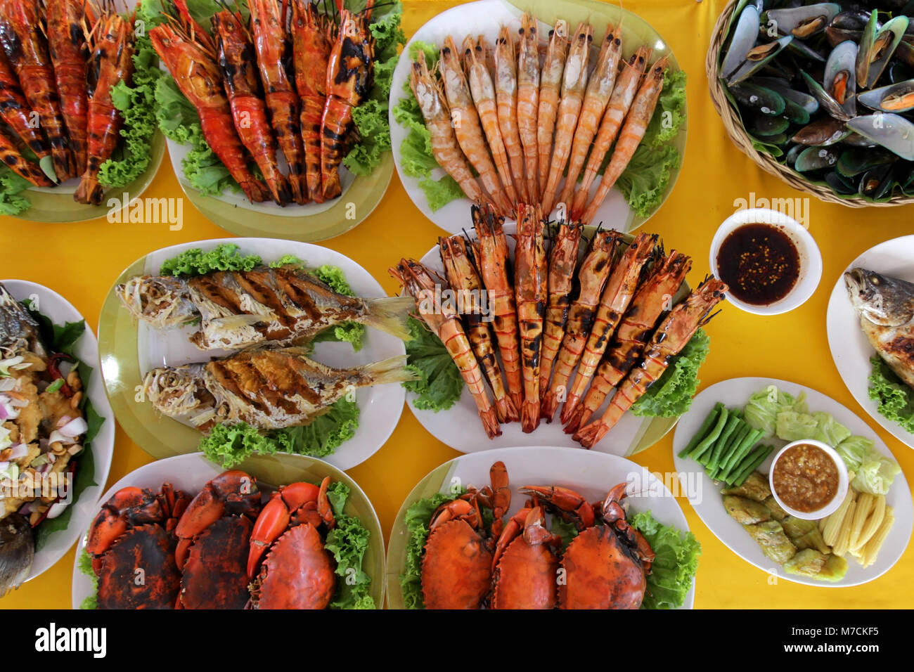 many kind of sea food on dining table for dinner Stock Photo - Alamy