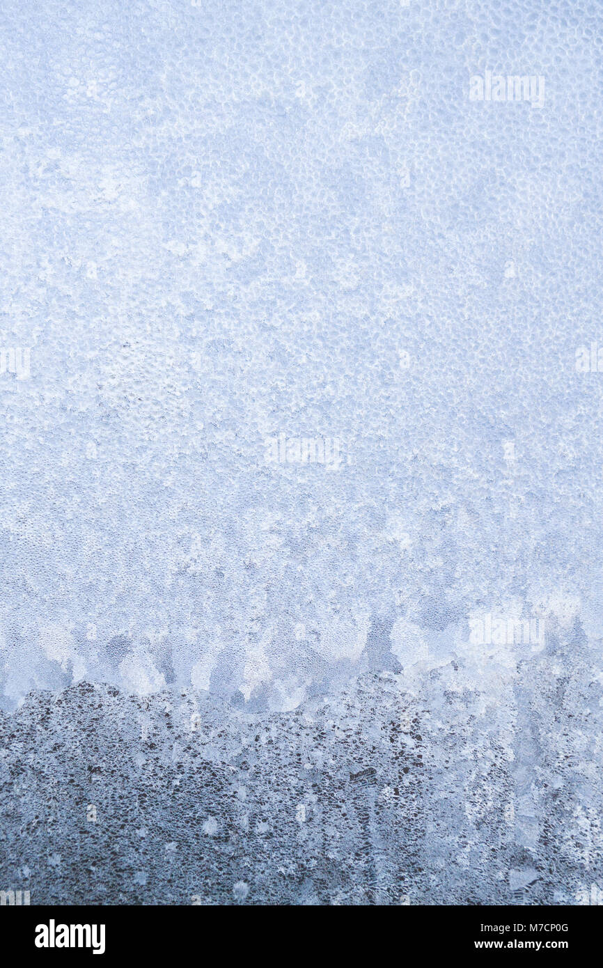 Winter frosty patterns on the frozen ice window Stock Photo - Alamy