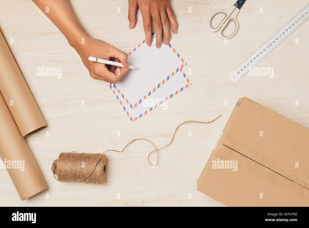 Cardboard boxes on work place in post office Stock Photo - Alamy