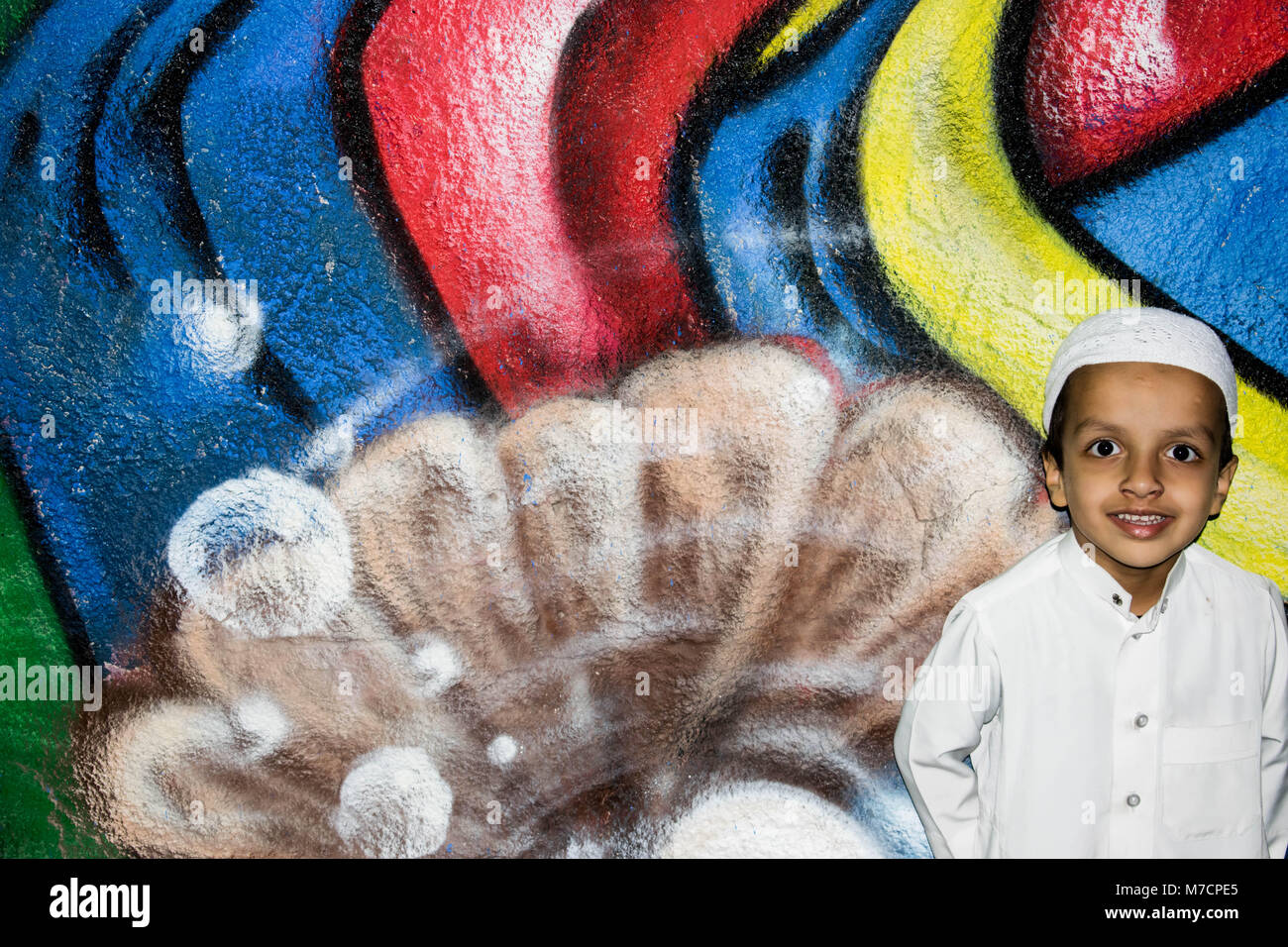 Muslim boy street art background Stock Photo - Alamy
