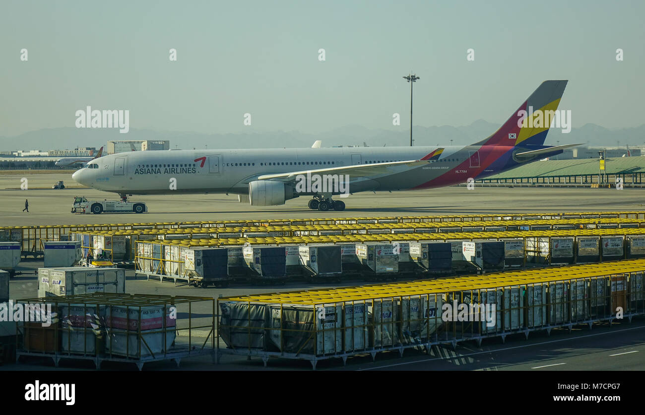 Beijing, China - Mar 1, 2018. An Asiana aircraft running on runway at ...