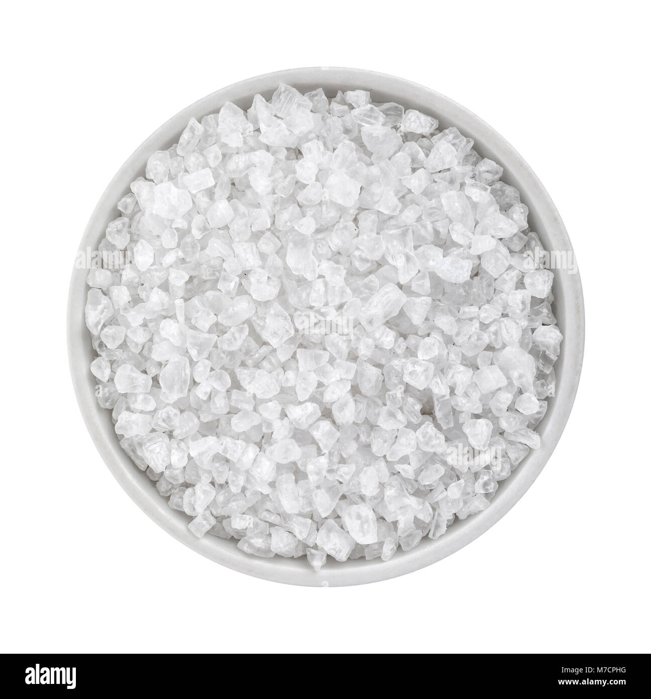 Coarse sea salt on white background closeup top view Stock Photo - Alamy